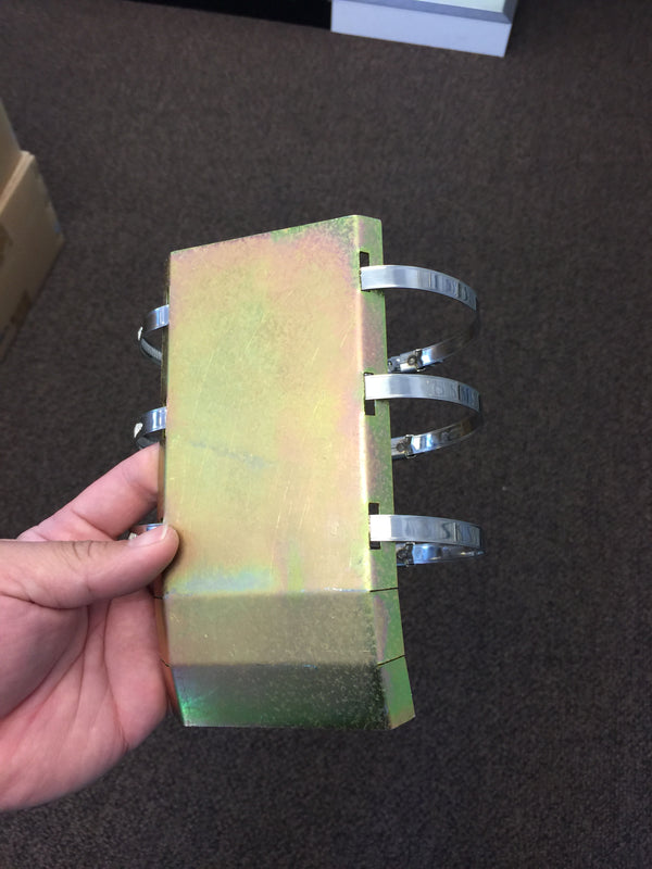 Steel header skid plate